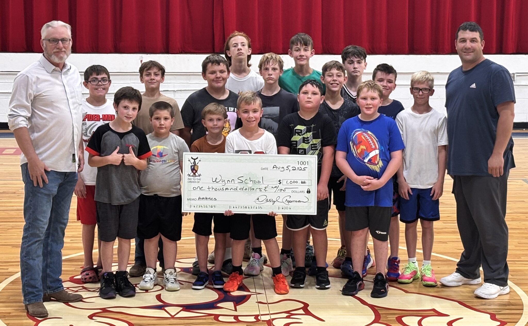 Darryl Chapman delivers check for Wynn School Athletics – WLAF